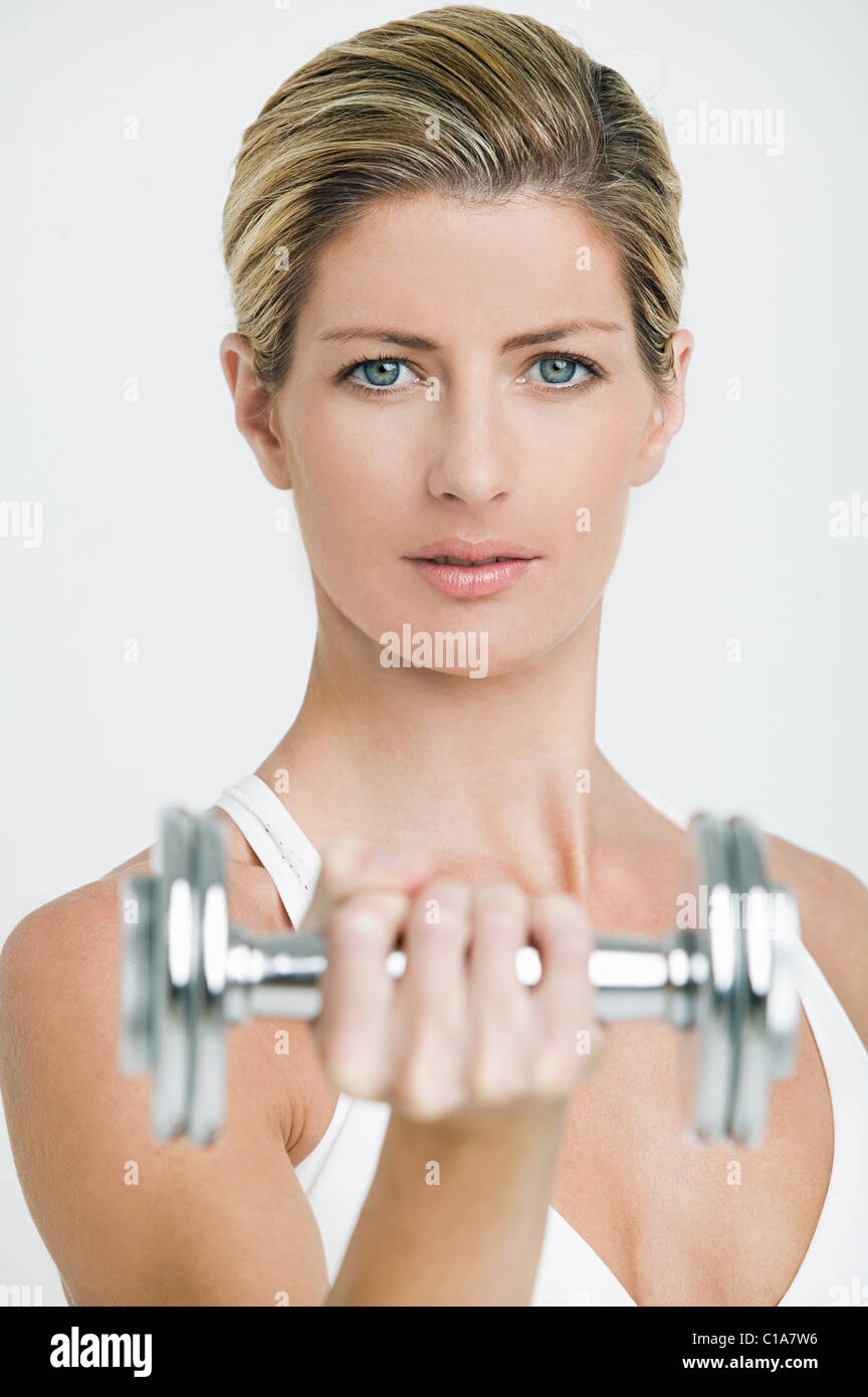 Young woman with hand weights Stock Photo - Alamy