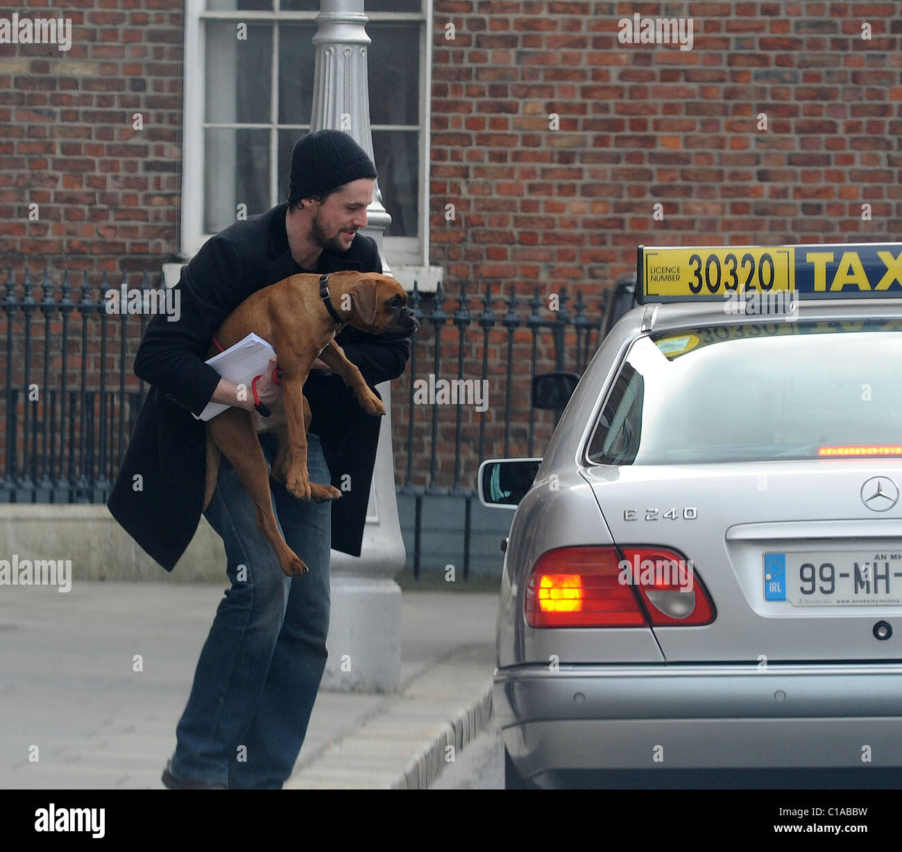 Watchmen star Matthew Goode hailing a taxi with his Boxer puppy Dublin ...