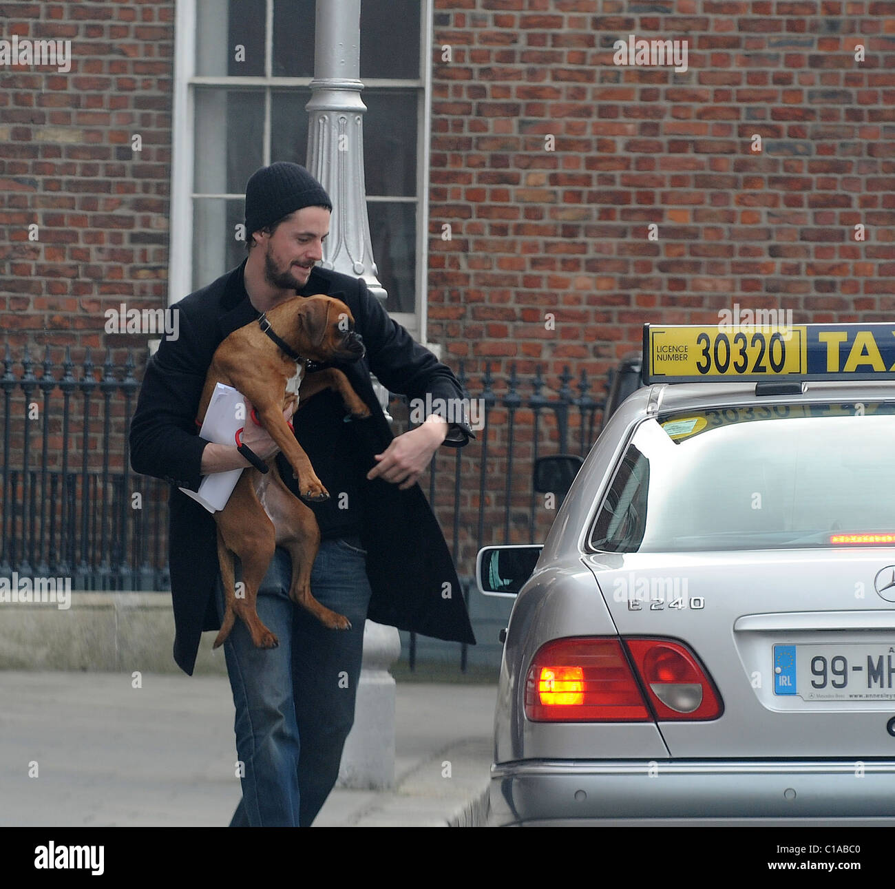 Watchmen star Matthew Goode hailing a taxi with his Boxer puppy Dublin ...