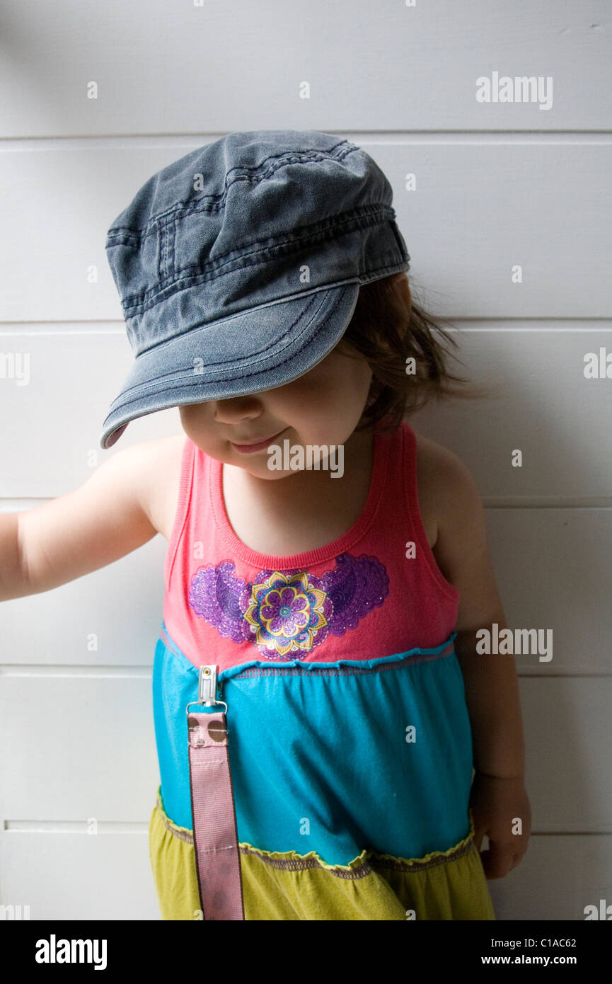 Girl with oversized cap on Stock Photo - Alamy