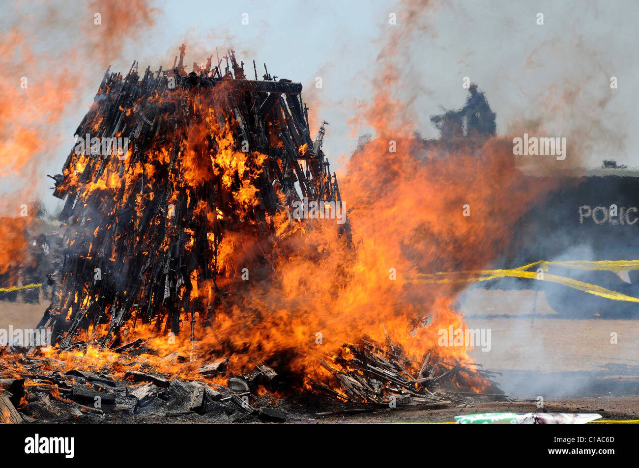 ALL GUN IN A PUFF OF SMOKE A burning pyre, consisting of some 2,400 ...