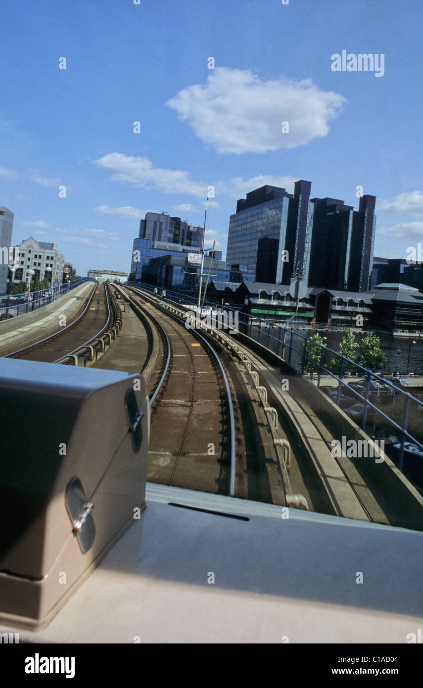 DLR Docklands Light Railway train approaching South Quay station London ...