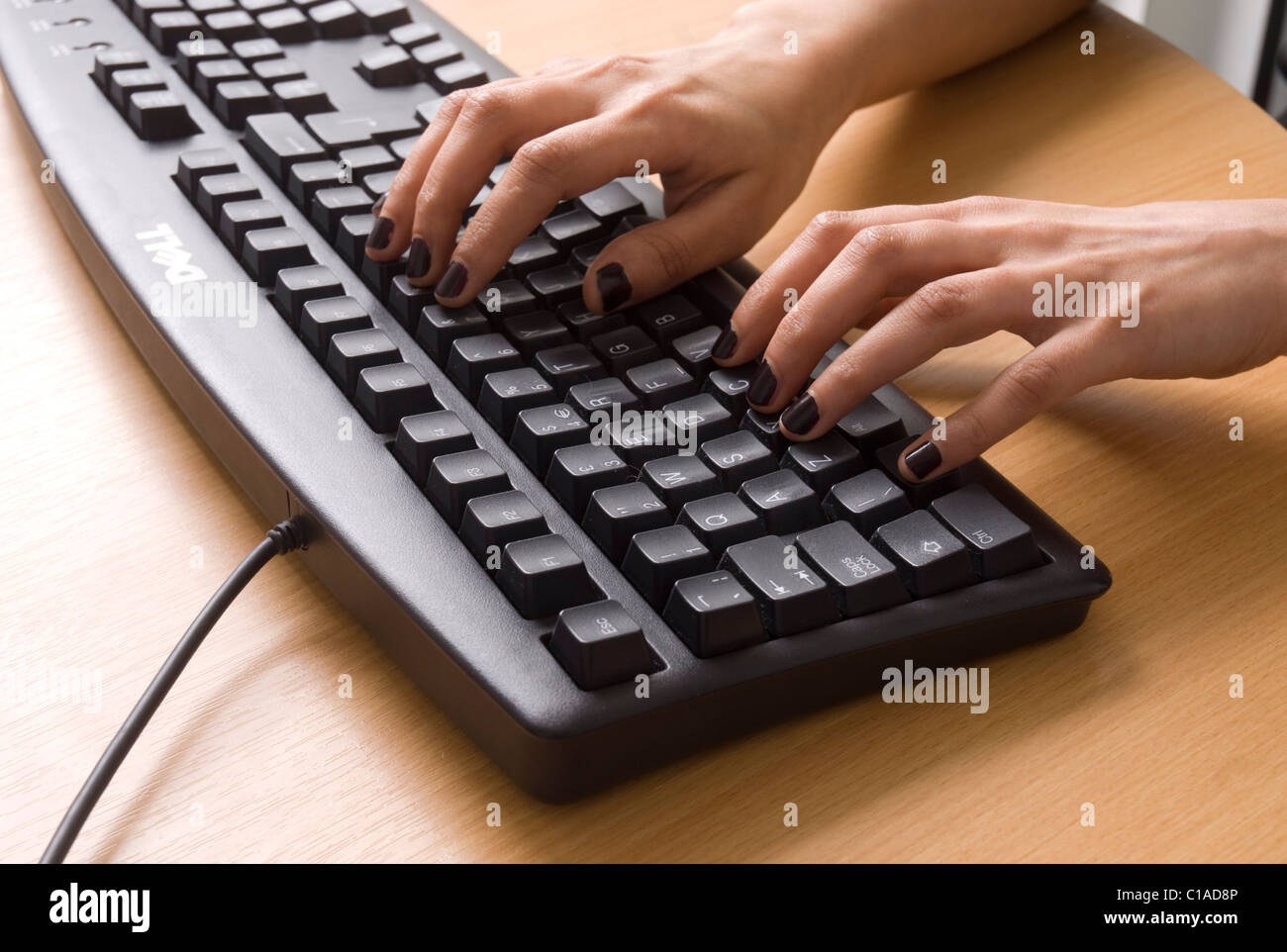 Typing on a computer keyboard Stock Photo - Alamy