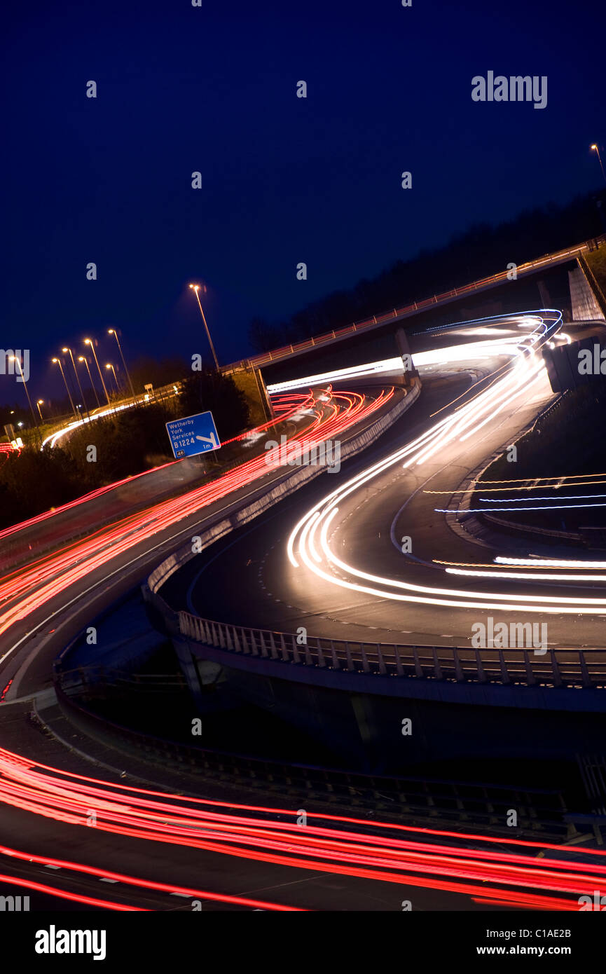 headlight trails of traffic travelling on the A1/M motorway near Leeds ...