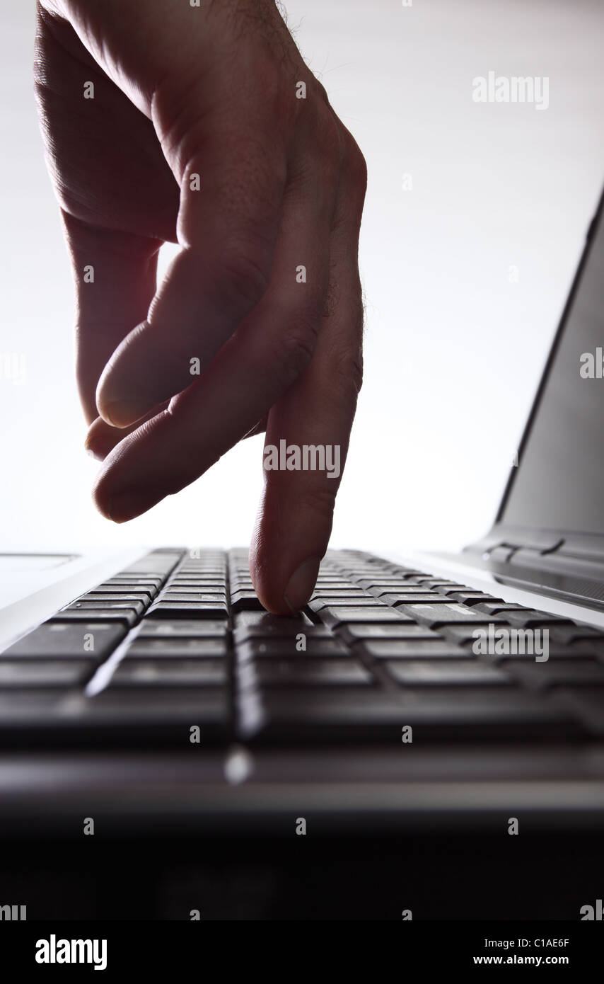 Hand over the black keyboard Stock Photo - Alamy
