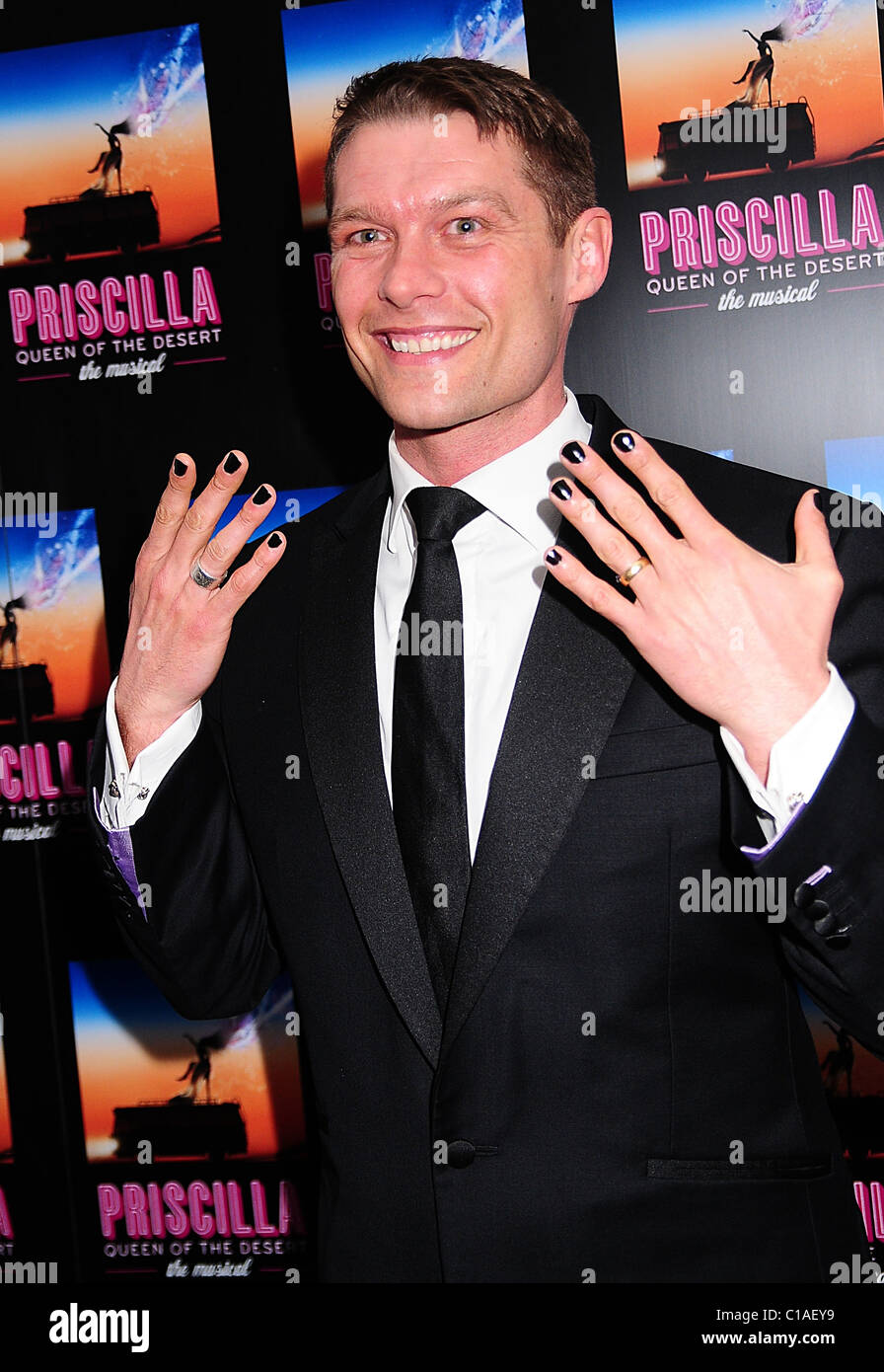 John Partridge performs on stage for the 'Priscilla Queen of the Desert ...