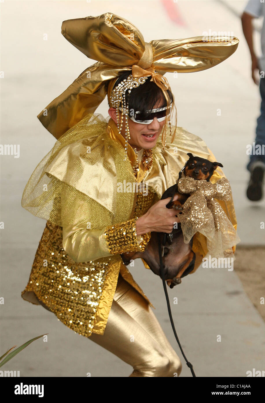 Bobby Trendy wearing gold outside Maxfield on Melrose modeling for the ...