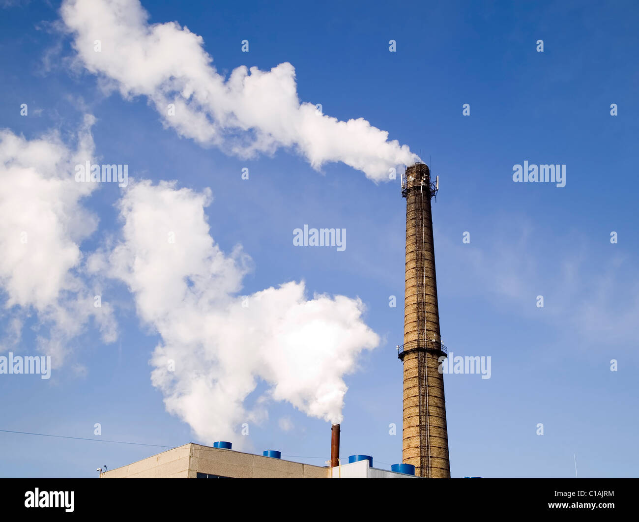Chimney of factory with smoke on sky background Stock Photo - Alamy