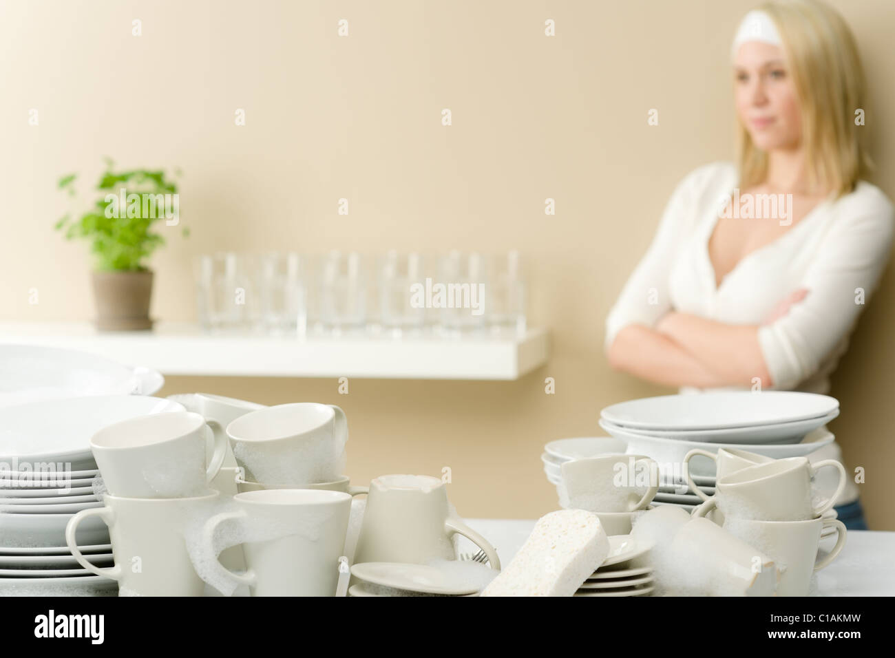 Modern kitchen - happy woman washing dishes having break Stock Photo ...