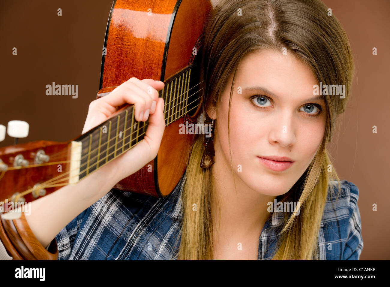 Rock musician - young fashion female model posing with guitar Stock ...