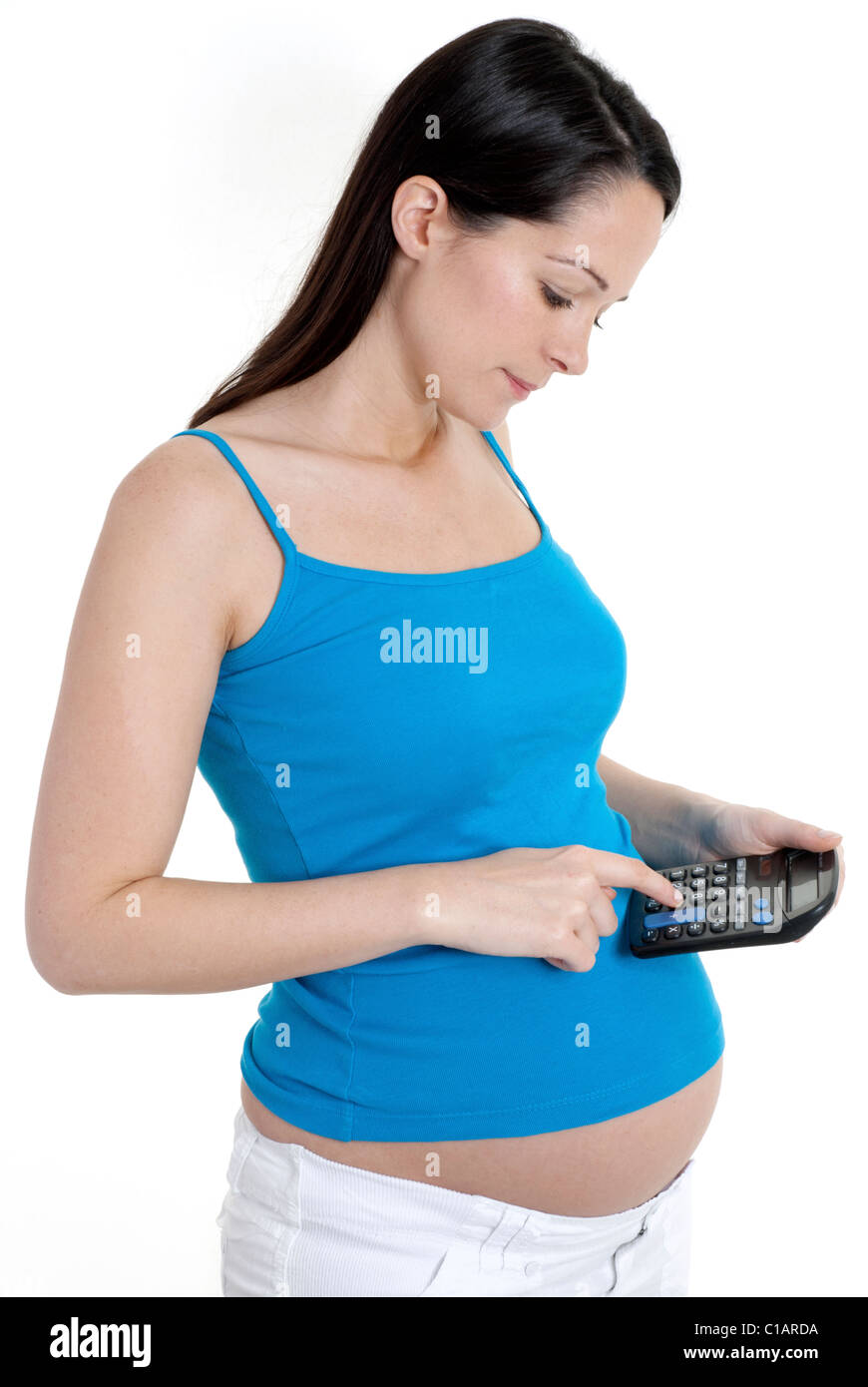 Pregnant woman using calculator Stock Photo - Alamy