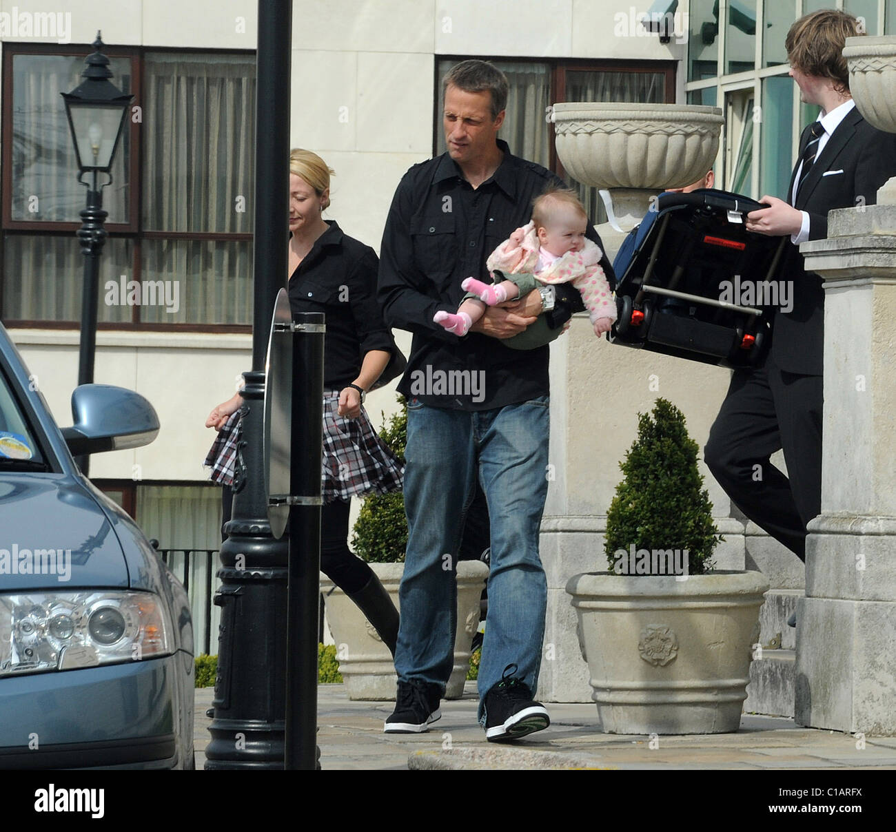 Skateboarder Tony Hawk leaving his hotel with wife Lhotse Hawk and ...