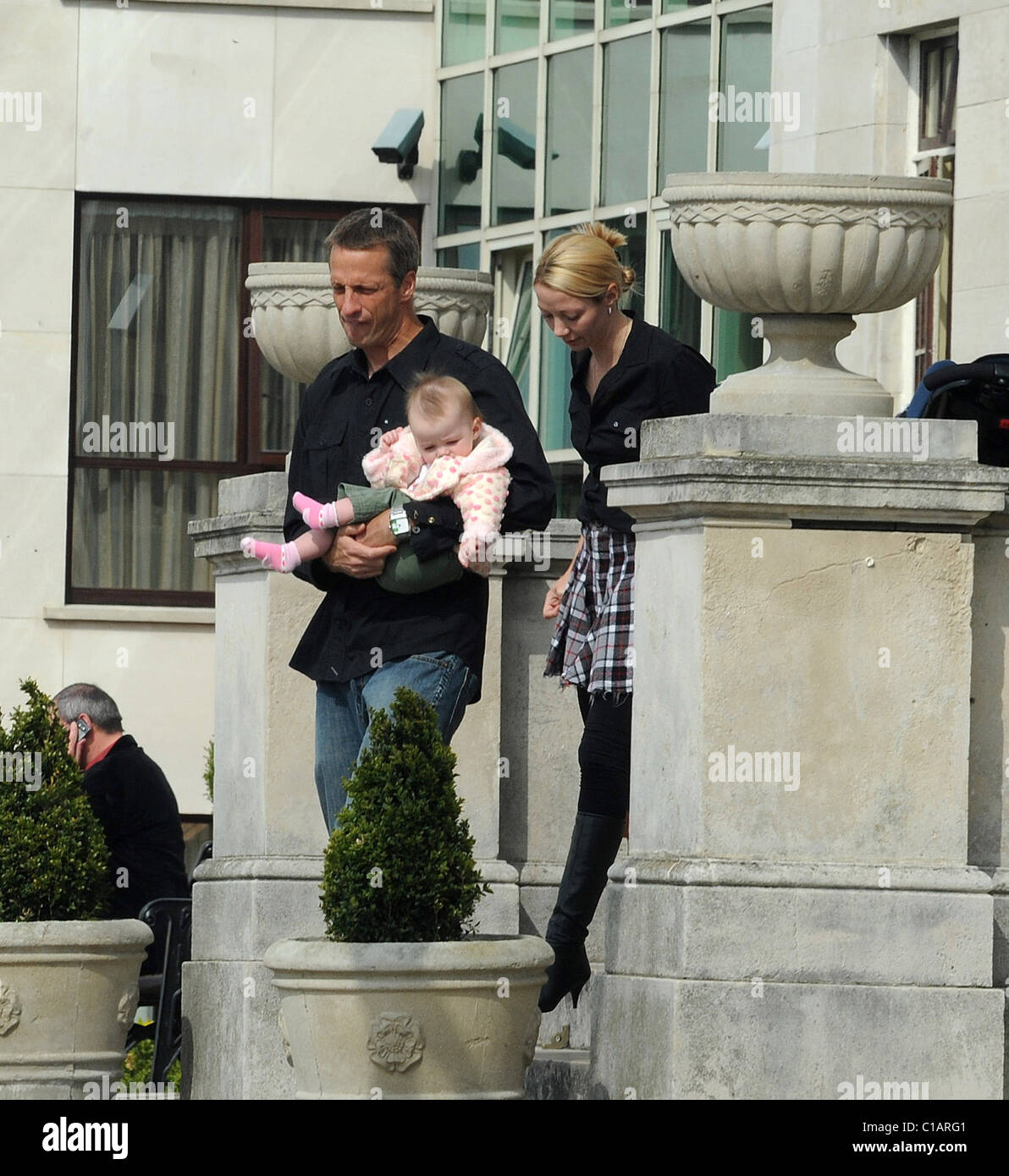 Skateboarder Tony Hawk leaving his hotel with wife Lhotse Hawk and ...