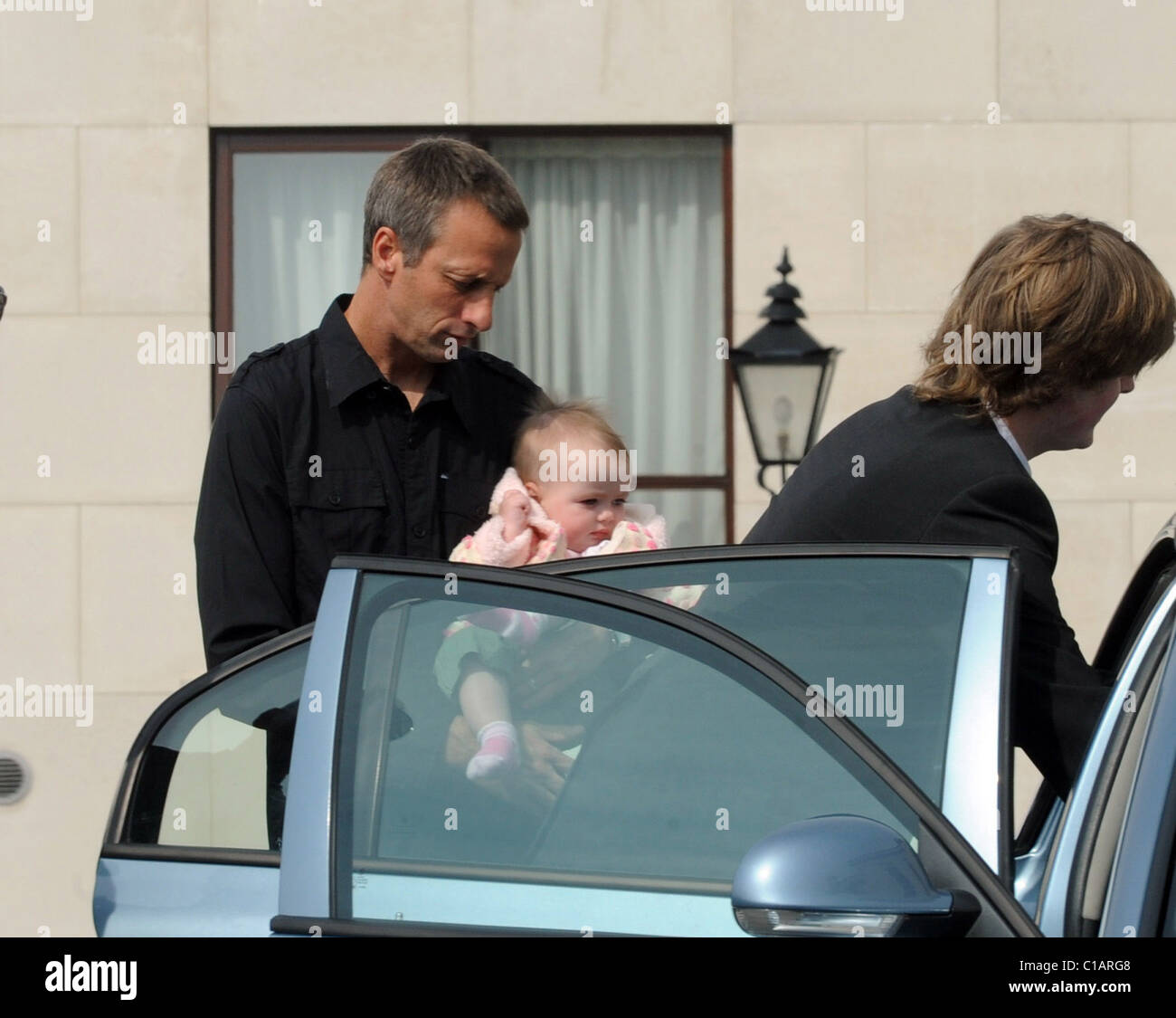 Skateboarder Tony Hawk leaving his hotel with wife Lhotse Hawk and ...