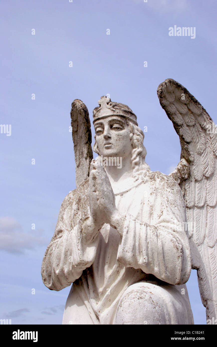 sculpture of white angel praying for good to all world Stock Photo - Alamy