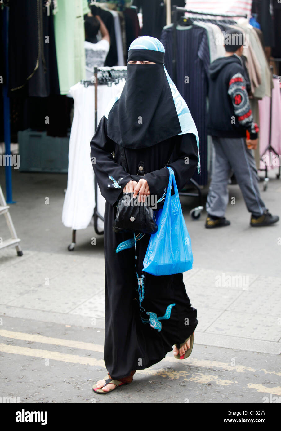 A women shops in Whitechapel, East London - 27th of July 2010 - whilst ...