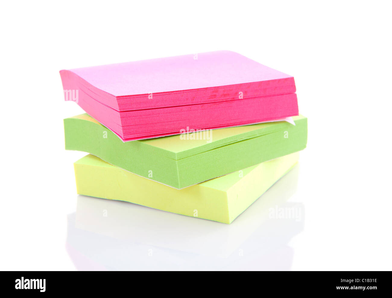 pile of colorful sticky paper over white background Stock Photo - Alamy