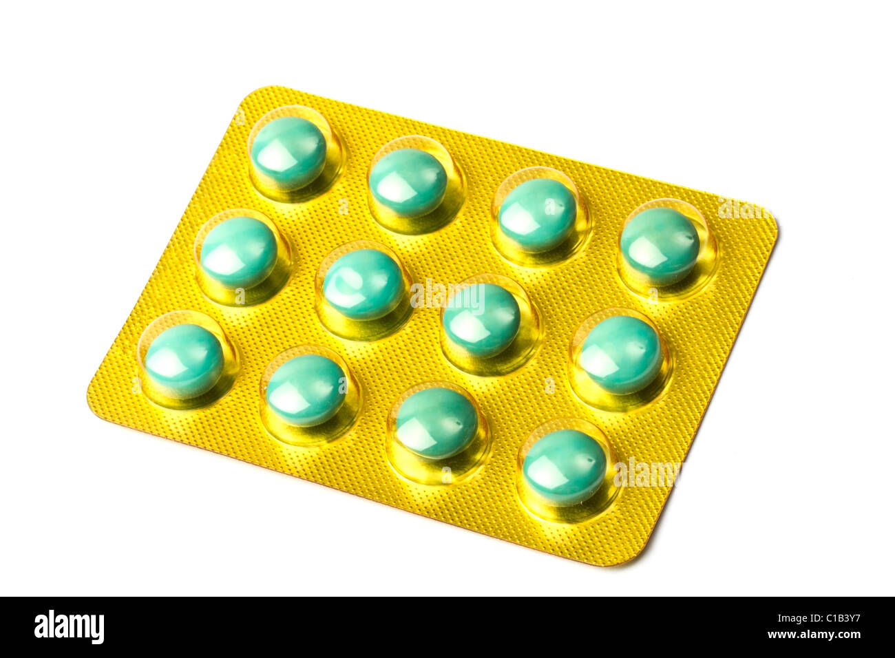 Package of green pills isolated on white background Stock Photo - Alamy