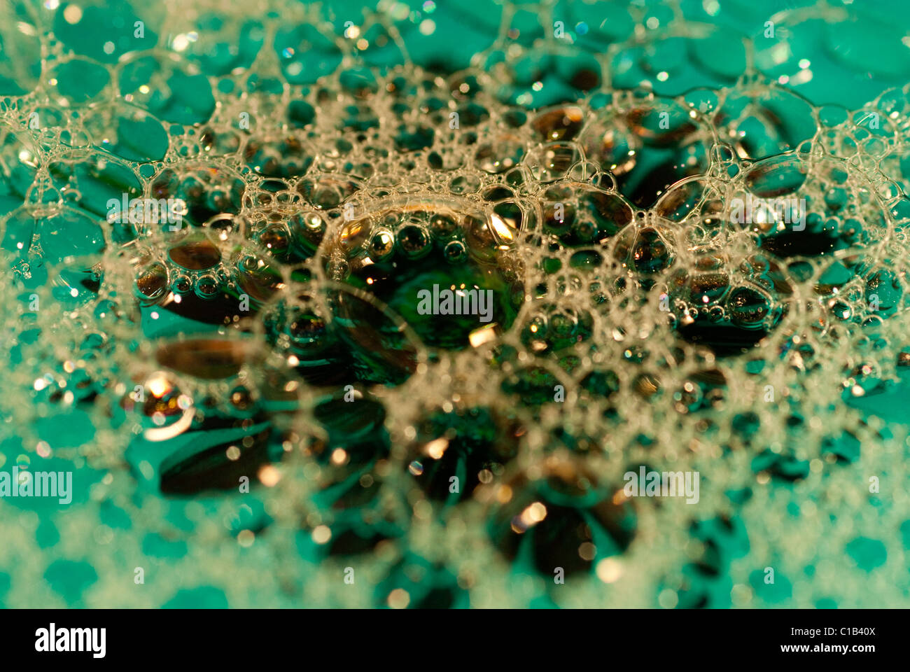 Bubbles covering a flowered plate Stock Photo - Alamy