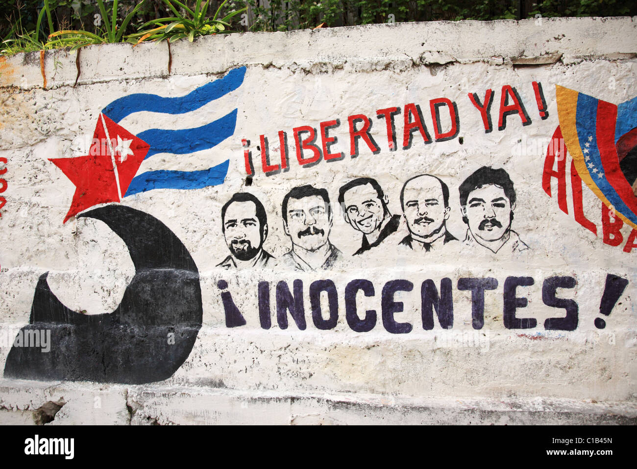 Graffiti depicting the 5 Cuban Heroes on a wall in Cuba Stock Photo - Alamy