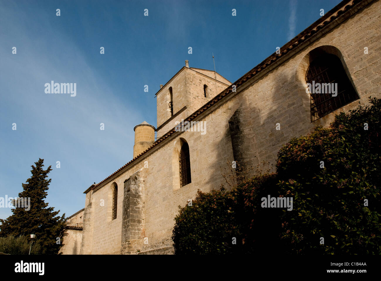 Old French church seen from side with blue sky overhead Stock Photo - Alamy