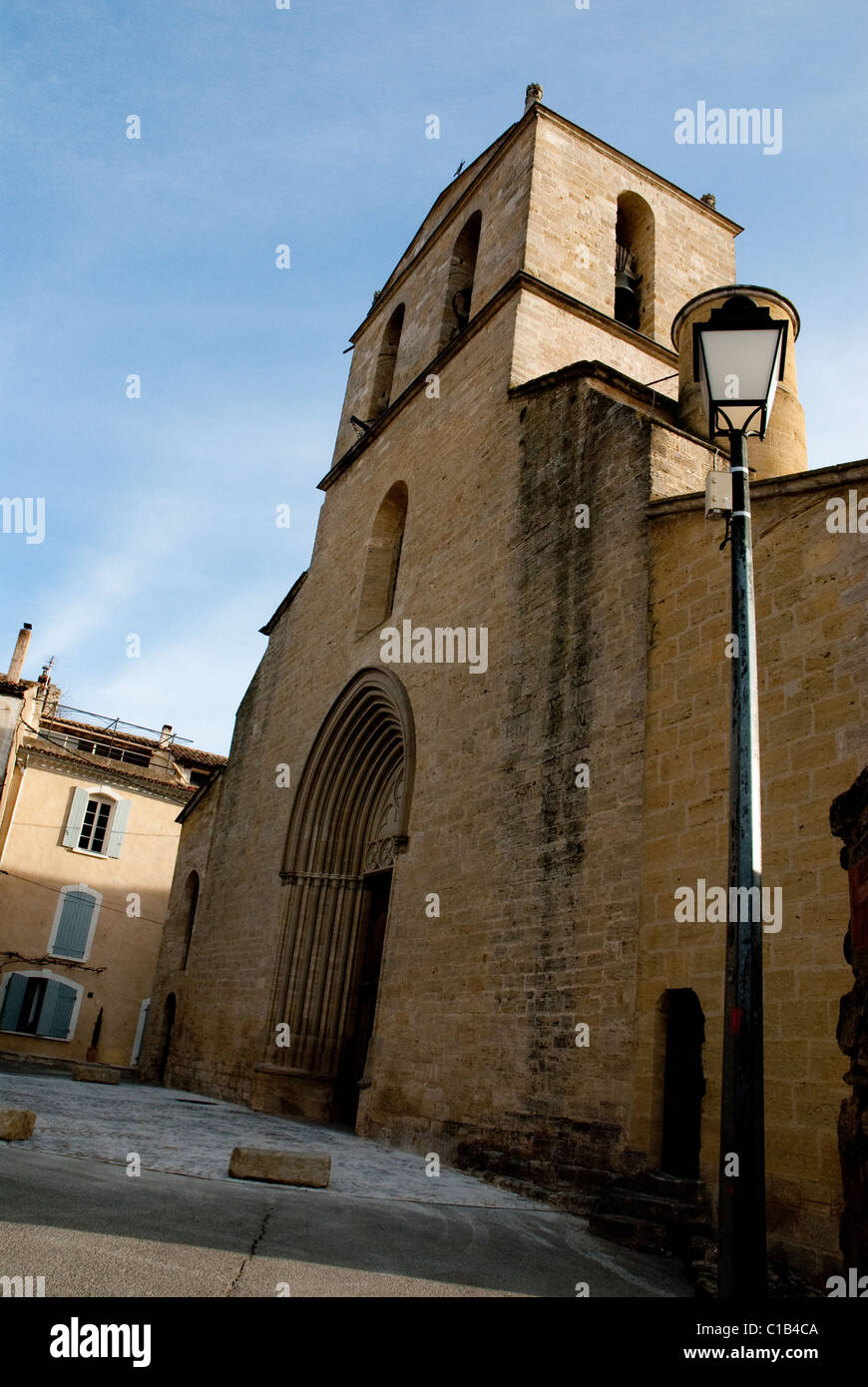 An image of the front facade of a church taken from below to the right ...