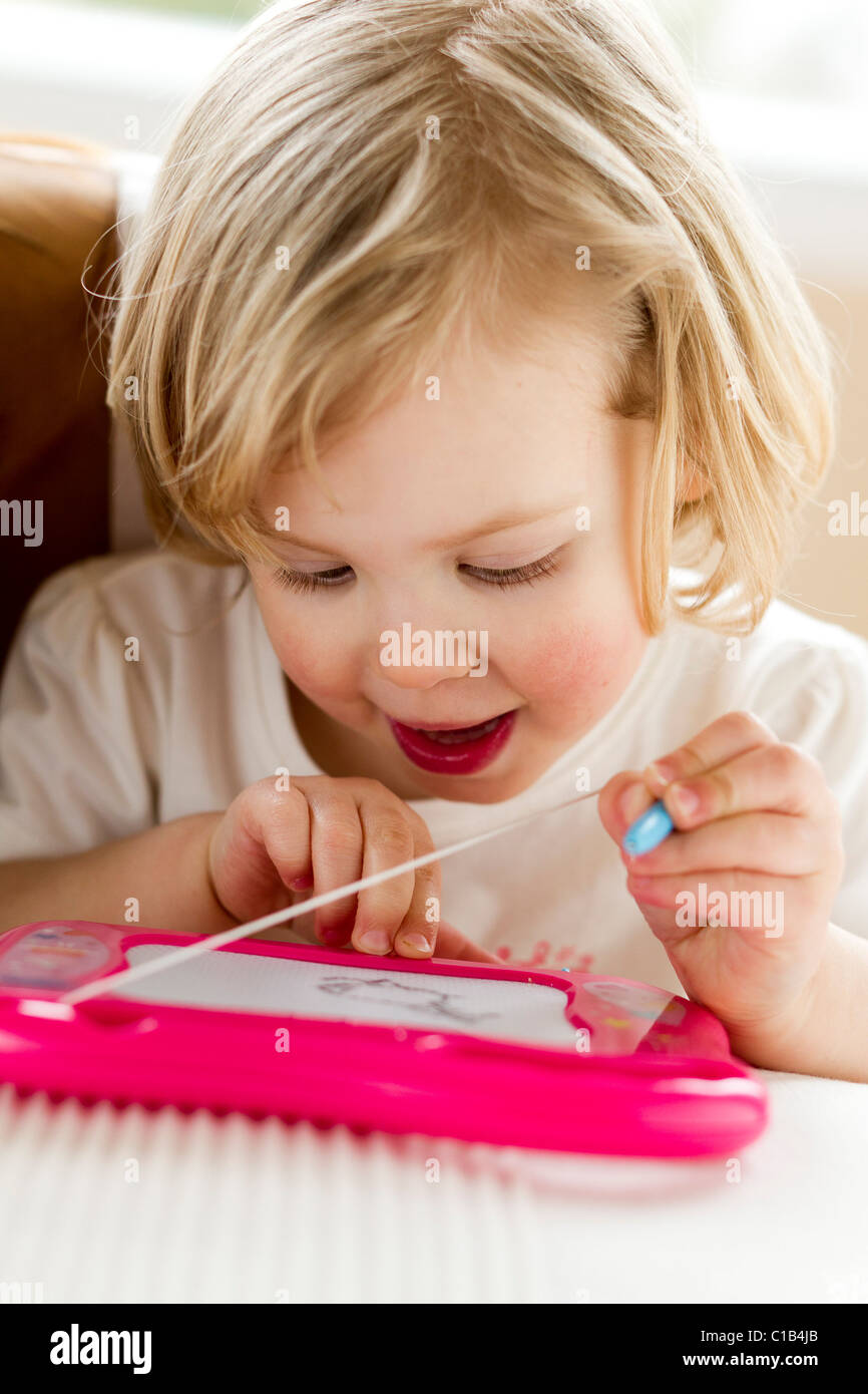 Mother and child writing/drawing Stock Photo - Alamy