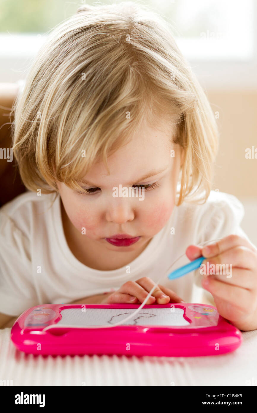 Mother and child writing/drawing Stock Photo - Alamy