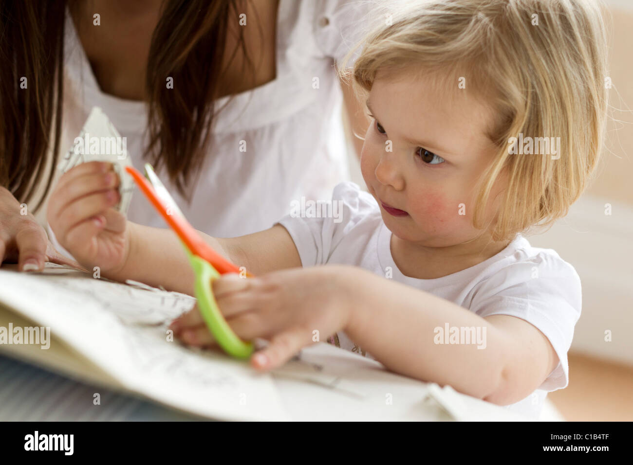 Child using scissors Stock Photo - Alamy