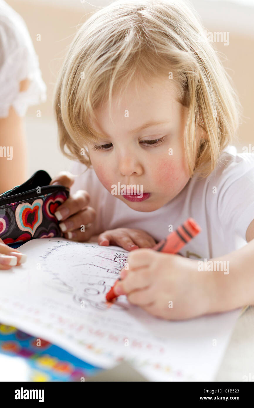Mother and child writing/drawing Stock Photo - Alamy