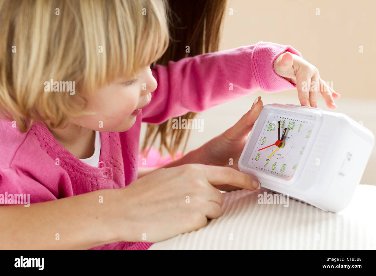 Mother and child with clock Stock Photo - Alamy