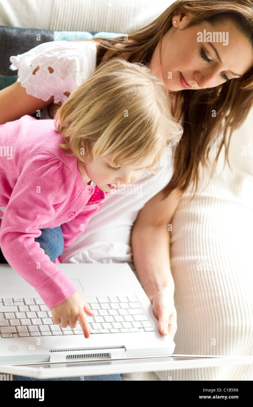 Mother and daughter using computer Stock Photo - Alamy