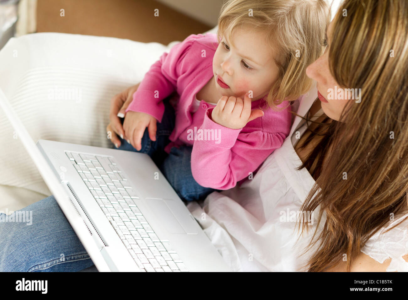 Mother and daughter using computer Stock Photo - Alamy