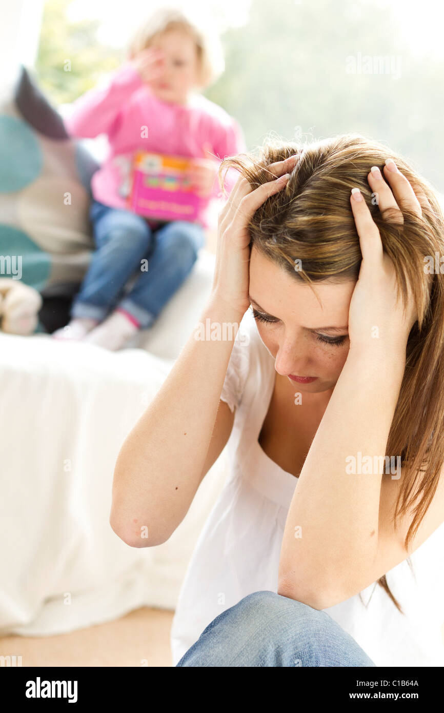 Stressed mother with child Stock Photo - Alamy