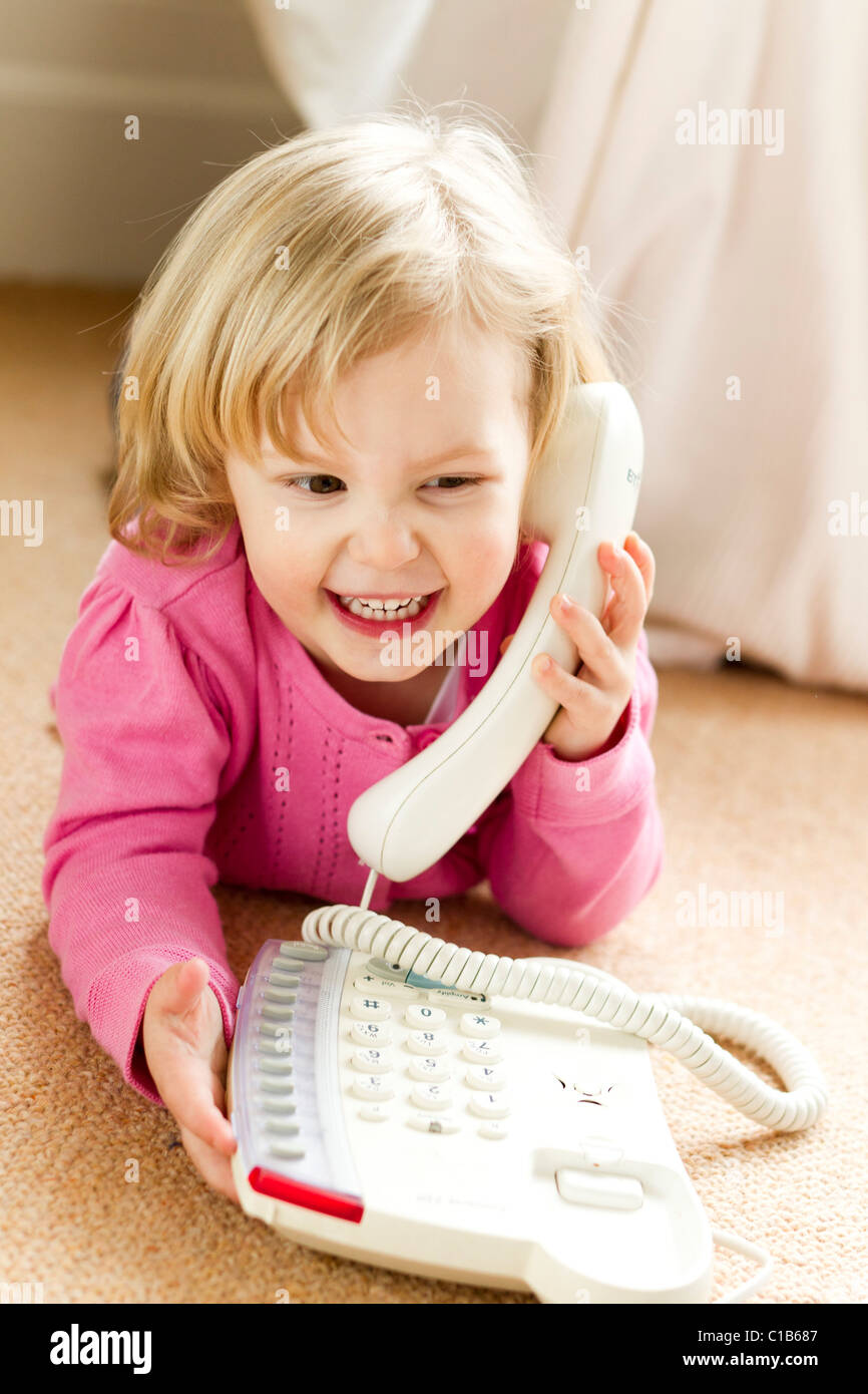 Child talking on telephone Stock Photo - Alamy