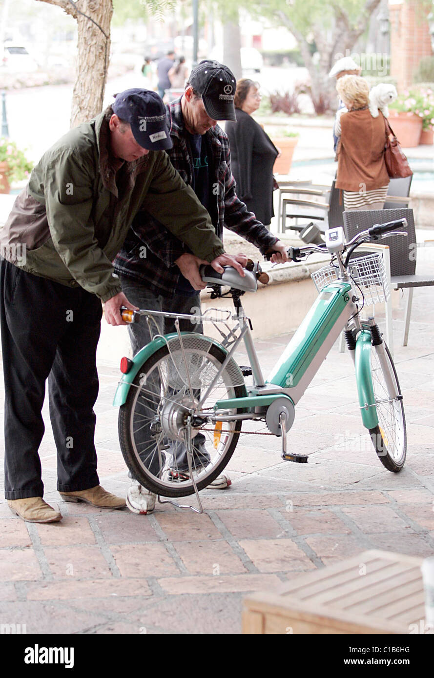 Kevin Dillon from the TV show "entourage" looks over an electric bike ...