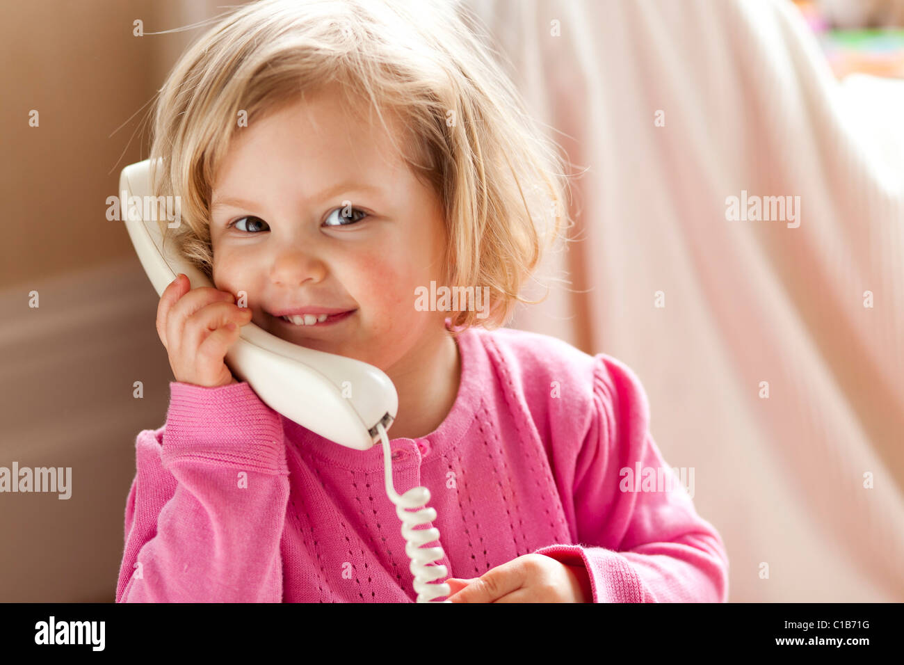 Child talking on telephone Stock Photo - Alamy