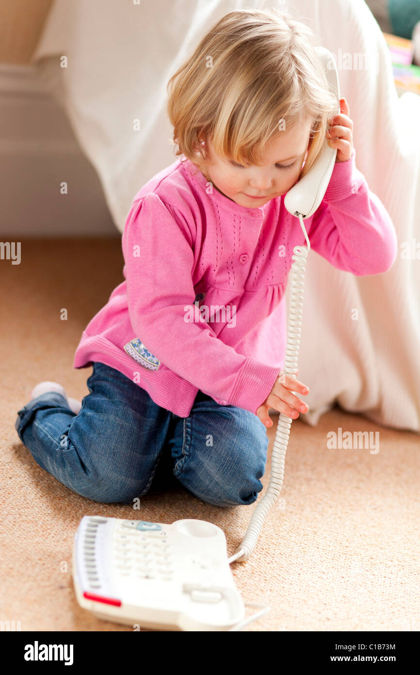 Child talking on telephone Stock Photo - Alamy