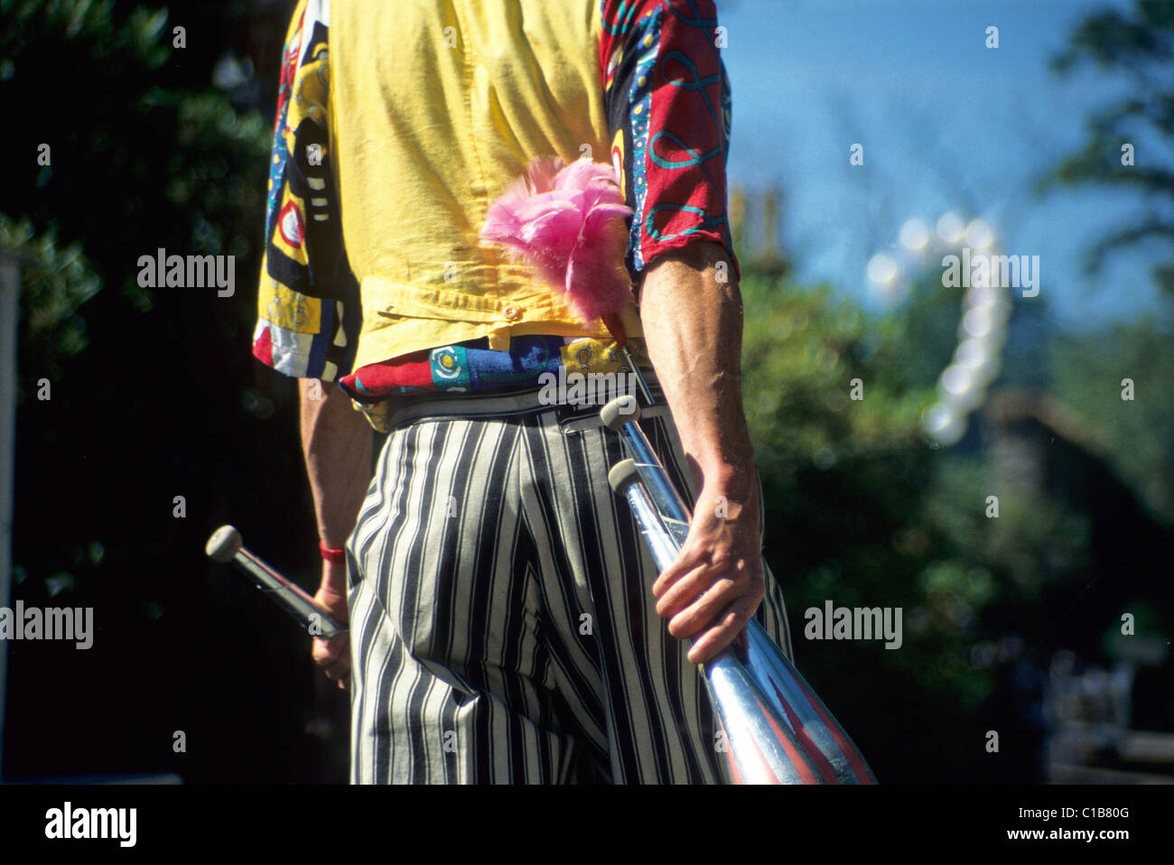 rear view of performing clown on stilts with juggling clubs, Traquair ...
