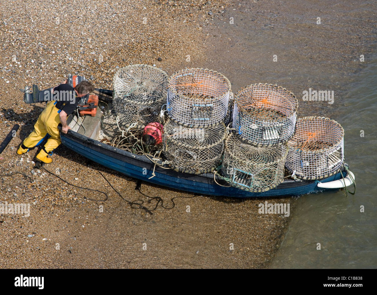 Fisherman wearing yellow hi-res stock photography and images - Alamy