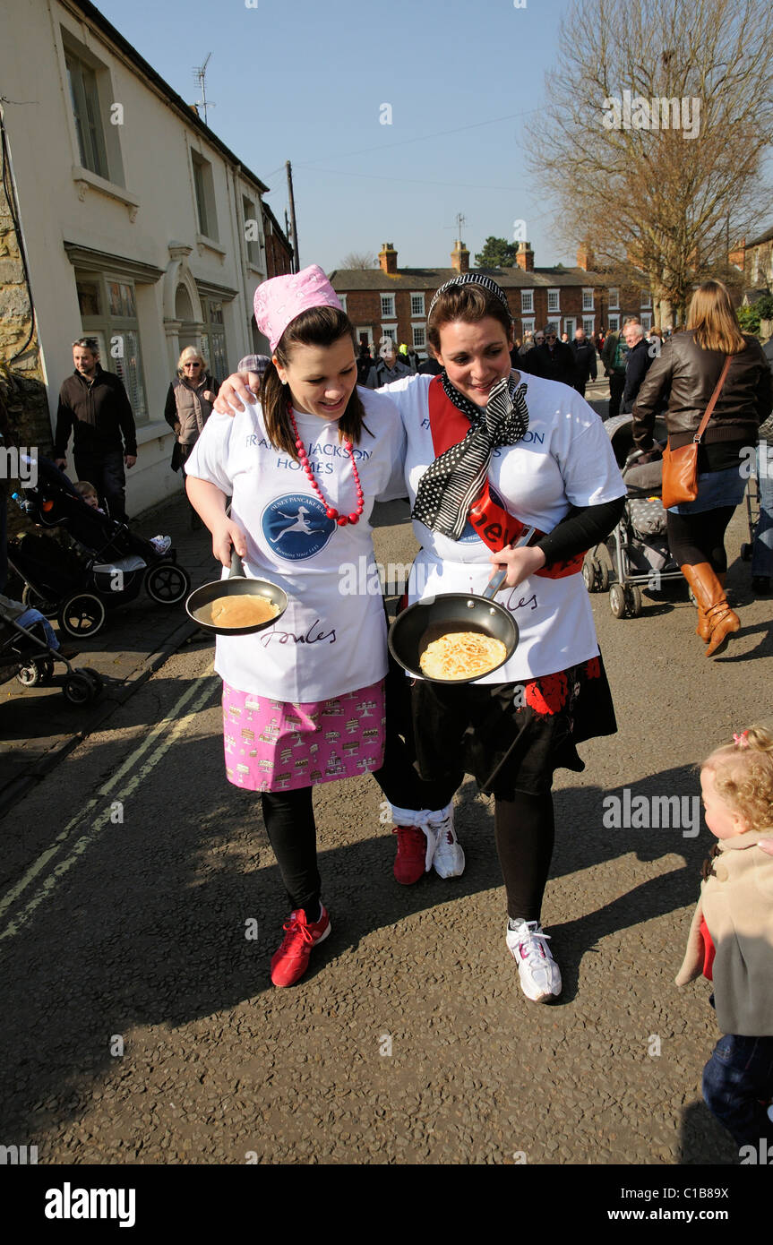 Olney Pancake race two young women competing in this annual three ...