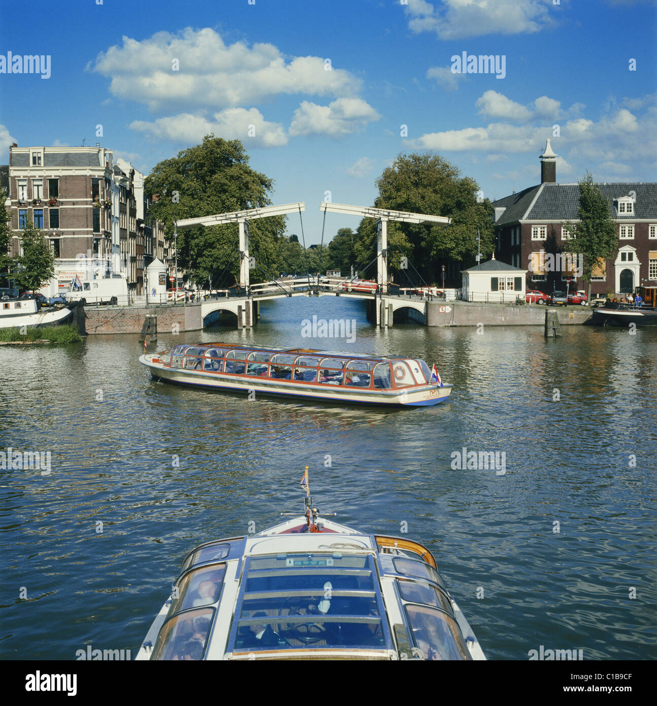 Amsterdam canal tour boats, Holland the Netherlands Stock Photo - Alamy