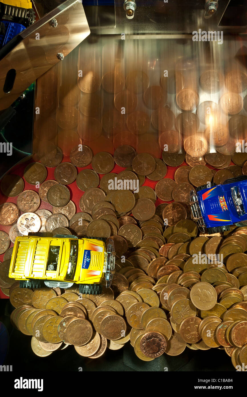 Coins in gambling machines at Whitby in North Yorkshire Stock Photo - Alamy