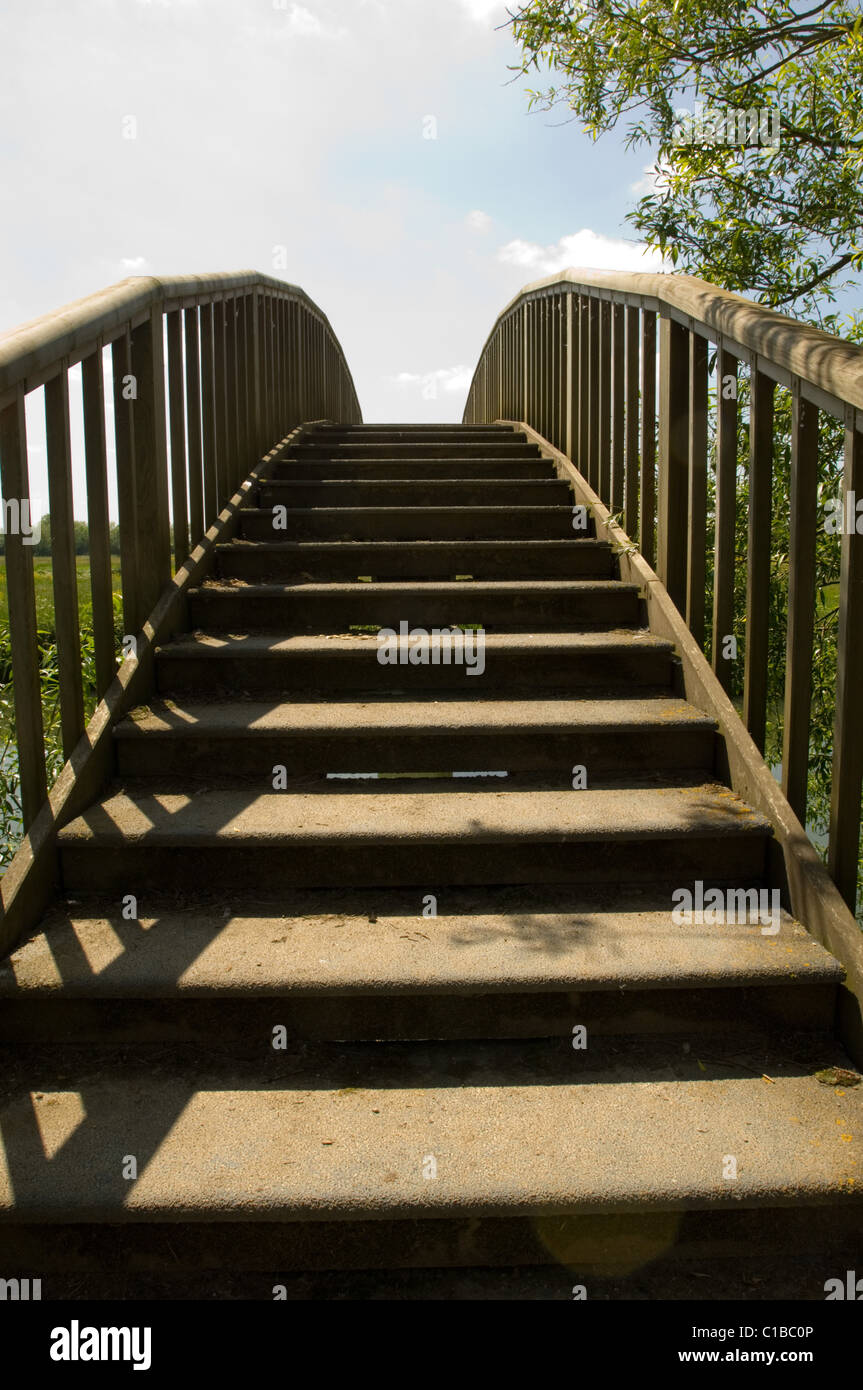 empty narrow arched bridge with steps climbing upwards Stock Photo - Alamy