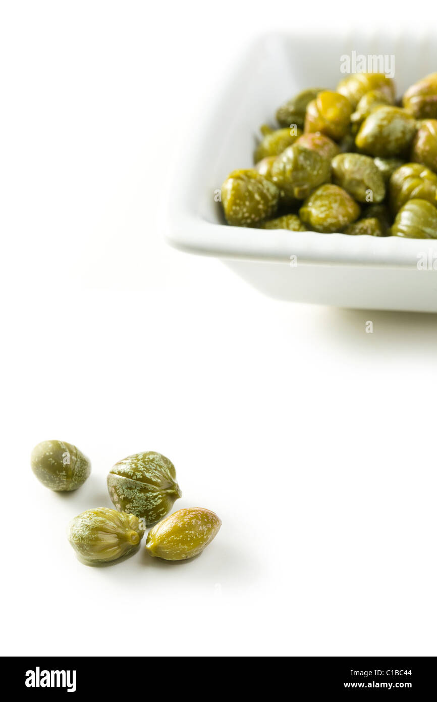 green capers on white background Stock Photo - Alamy