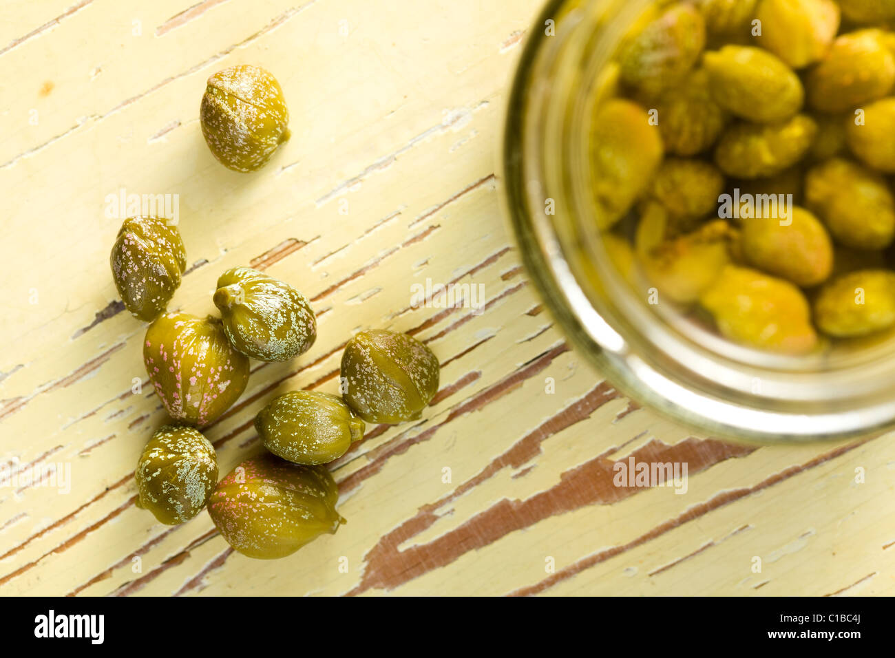 marinated capers on kitchen table Stock Photo - Alamy