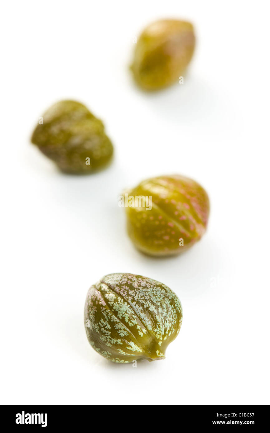 green capers on white background Stock Photo - Alamy