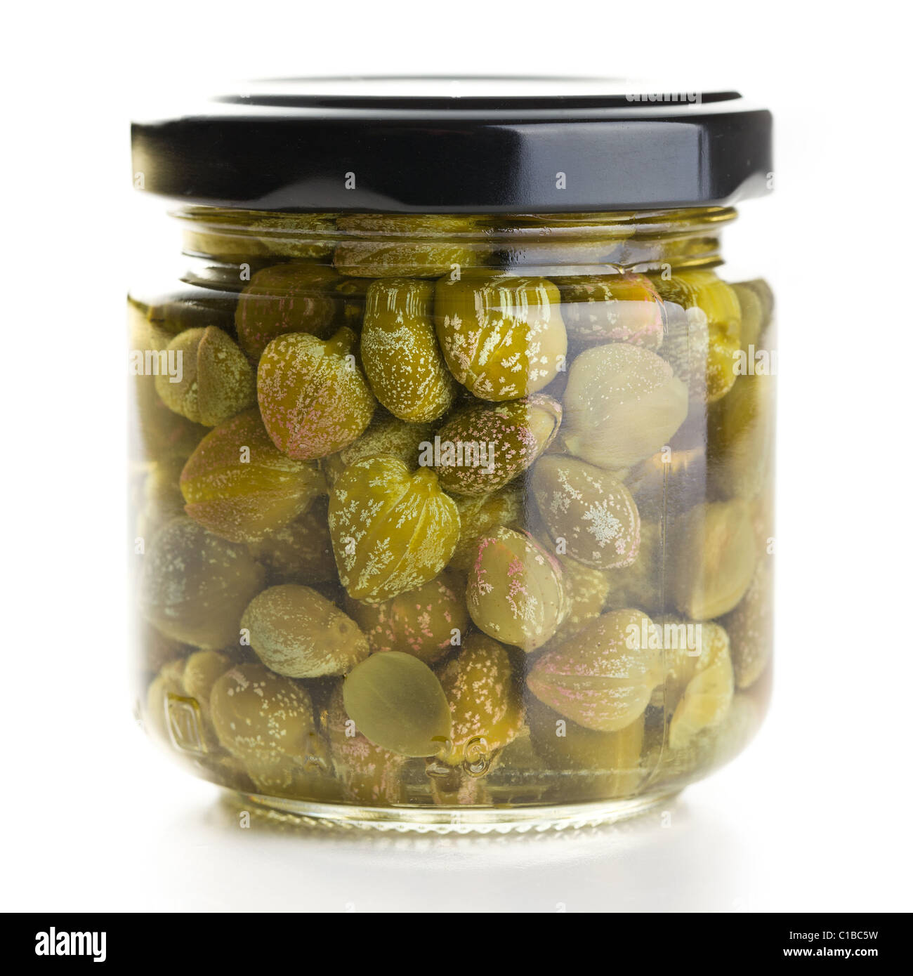 marinated capers on white background Stock Photo - Alamy