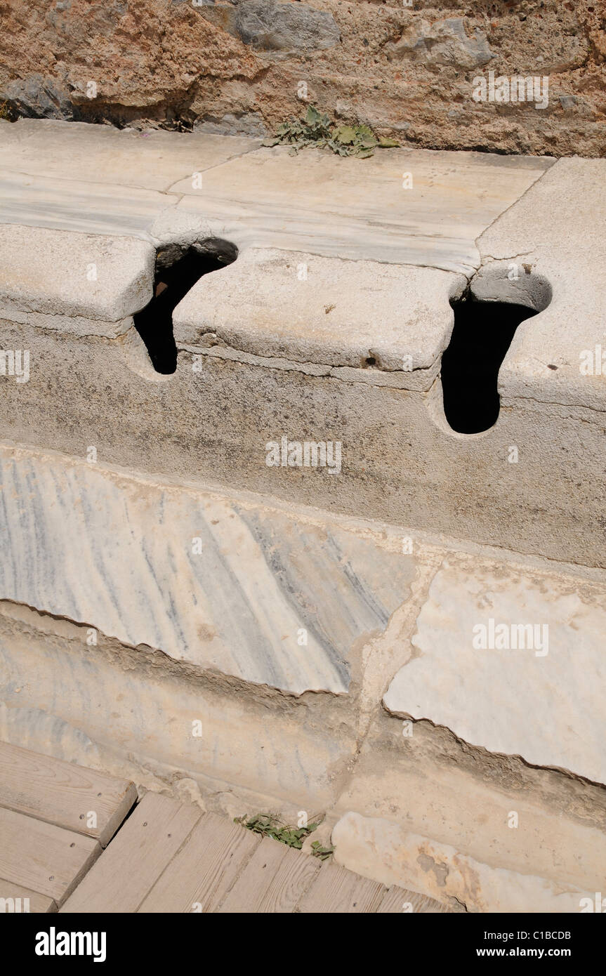 The ancient Latrina public toilets at the historic site of Ephesus in ...