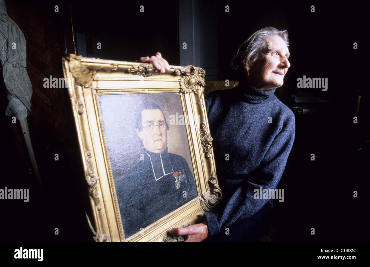 France, Manche, Mrs Lebec (old explorer) and the portrait of the old ...